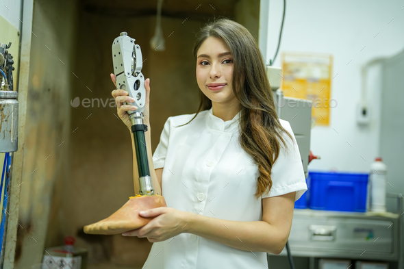 Orthopedic technician making prosthetic leg for disabilities people in workshop. Stock Photo by ...